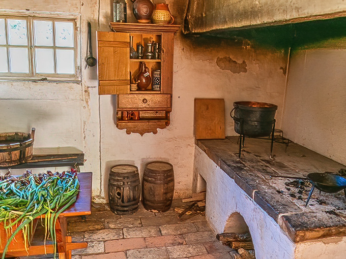 The original open kitchen concept. This traditional hearth served as both cooking area and social center&mdash;the 18th-century equivalent of gathering around the kitchen island.