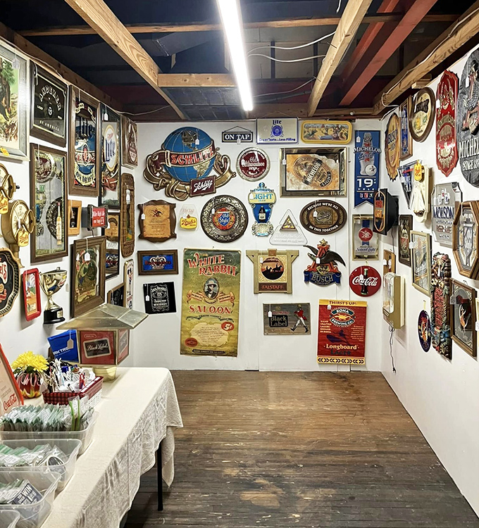 A wall of nostalgia where beer signs and vintage advertisements remind us that marketing has always known how to tug at our heartstrings.