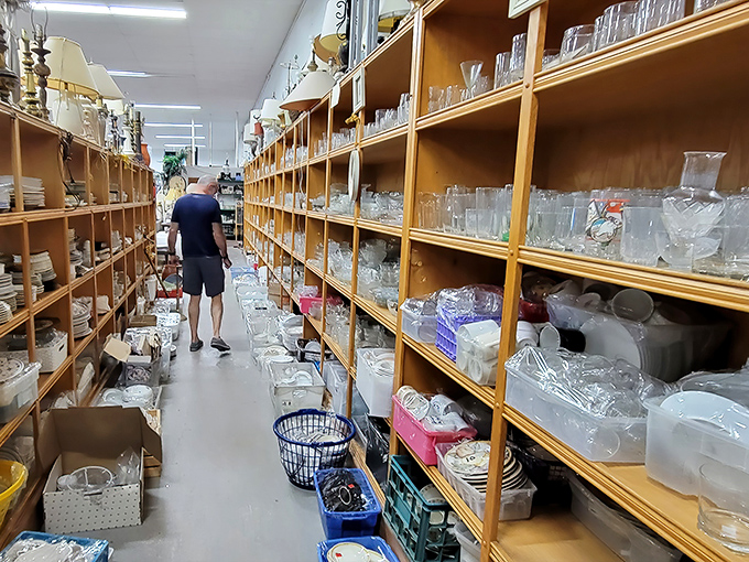 The glassware aisle stretches into infinity, a crystal-clear reminder that one person's castoff becomes another's prized serving piece for holiday gatherings.