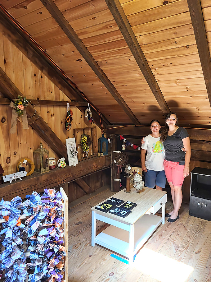 The warm pine interior creates the perfect backdrop for displaying handcrafted goods. Those exposed beams tell stories all their own.