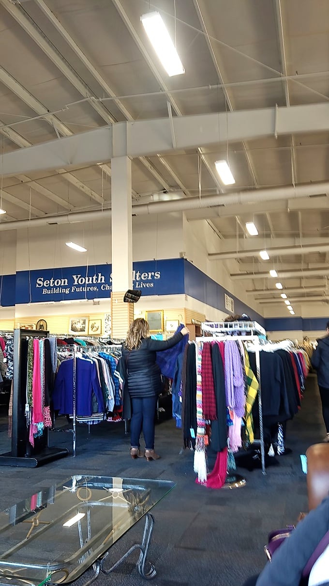 The art of thrifting in action &ndash; carefully examining each piece like a detective searching for clues to hidden value.