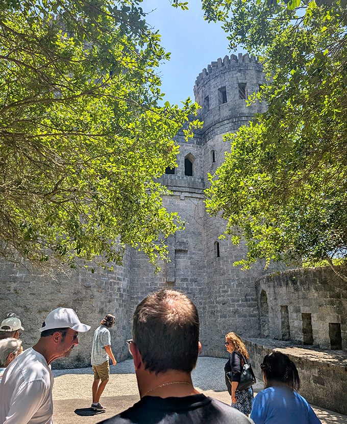 Visitors explore the castle's upper level, where Florida's horizon stretches out before them. No moat monsters included, thankfully.