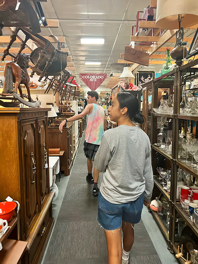 Shoppers navigate the narrow passages between furniture and collectibles, each turn revealing potential discoveries that might just need to come home.