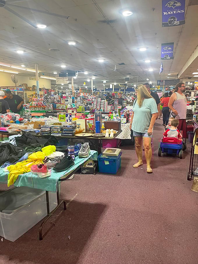 Baltimore Ravens banners watch over shoppers like guardian angels of retail therapy. The quest for deals unites generations.