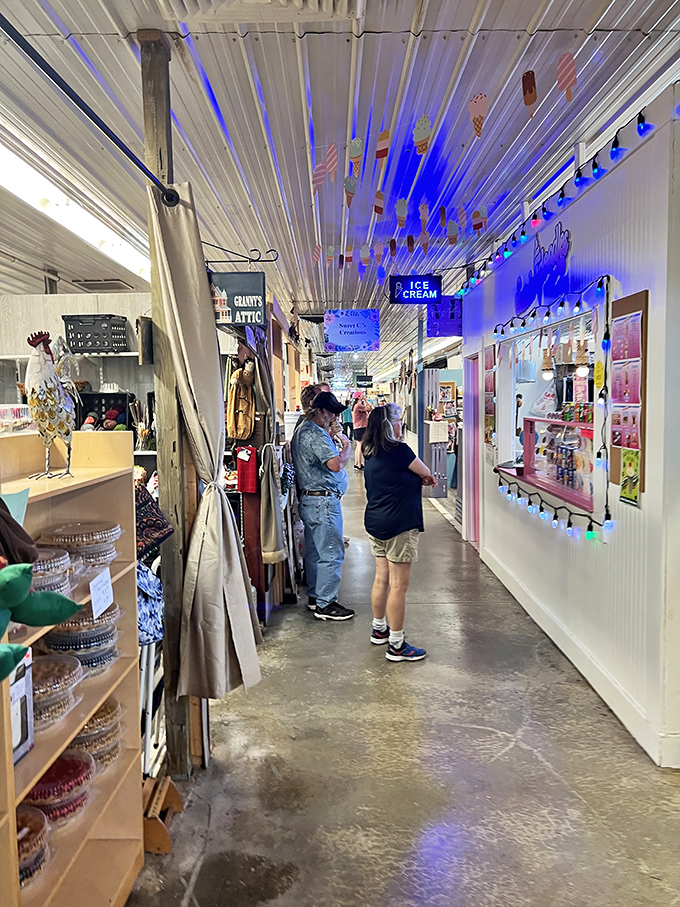 Blue lights illuminate this corridor of curiosities where "Grant's Attic" and an ice cream shop coexist in perfect retail harmony. Every turn reveals a new potential discovery.