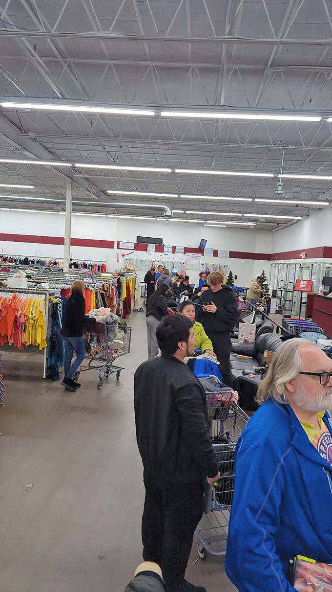 The checkout line: where strangers bond over their finds like archaeologists comparing artifacts from a particularly fruitful dig.