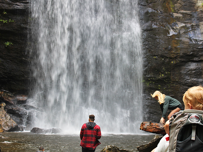 The universal pose of waterfall appreciation &ndash; stand, stare, and silently wonder how your shower at home suddenly seems inadequate.