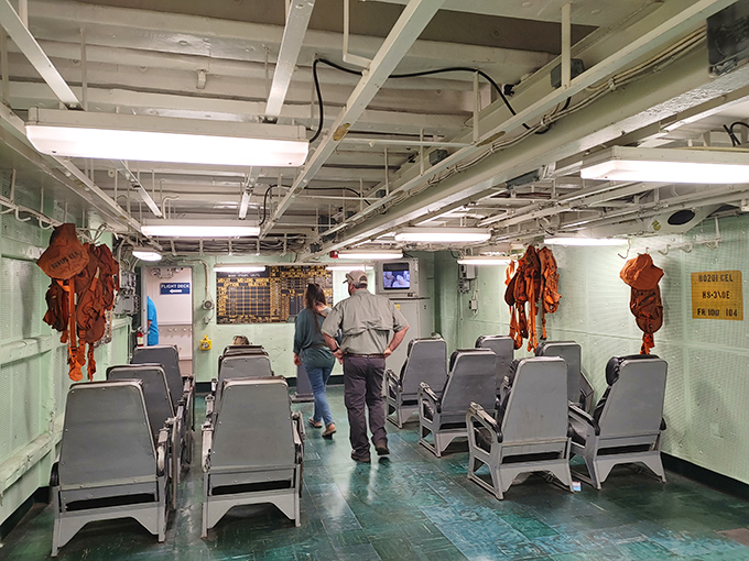 Below decks, visitors explore the surprisingly cramped quarters where sailors once lived, worked, and somehow managed to store all those orange life vests.