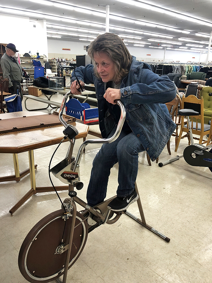 In the furniture section, a vintage exercise bike gets a test ride. Who needs Peloton when you've got retro charm?