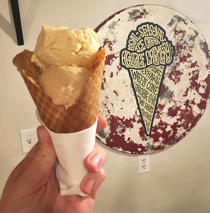 Golden waffle cone meets velvety ice cream against a backdrop of the shop's artisanal philosophy&mdash;proof that perfection comes in simple packages.