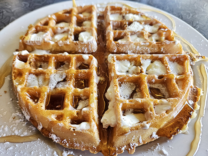 Golden waffles so perfect they look like they escaped from a Norman Rockwell painting.