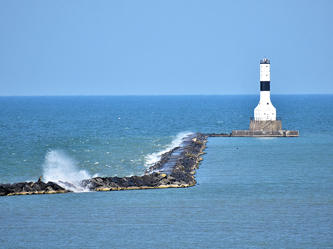The West Breakwater Lighthouse stands guard where waves crash dramatically against the rocks&mdash;maritime drama at its finest.