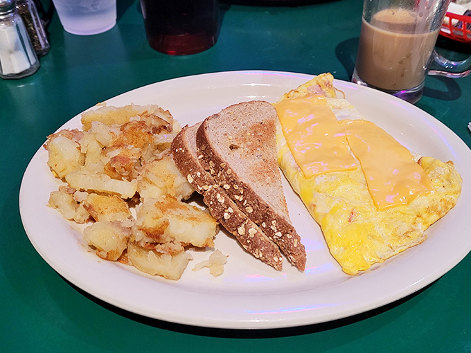 Breakfast doesn't get more honest than this &ndash; a fluffy omelet, crispy home fries, and toast that's ready to soak up last night's decisions.