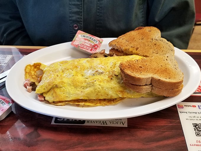 The Western omelet arrives like a golden sunrise on a plate, accompanied by toast that's achieved that perfect shade of "grandma would approve" brown.