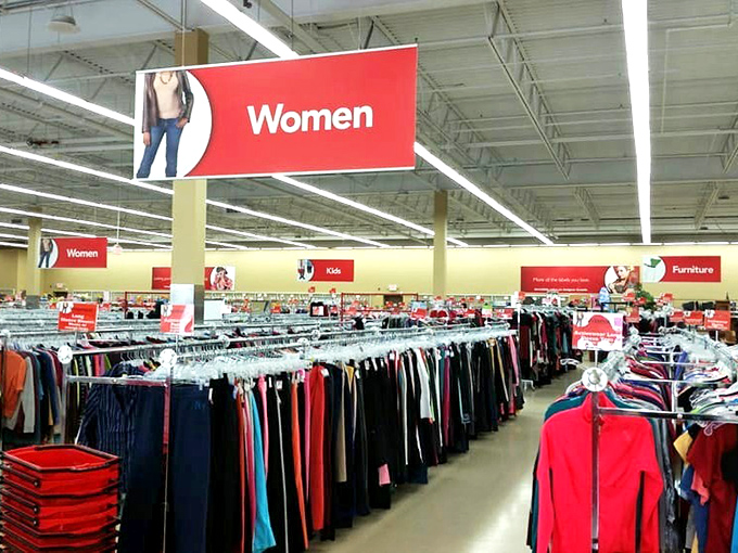 Under the watchful "Women" sign, generations of fashion trends hang shoulder to shoulder in peaceful coexistence.