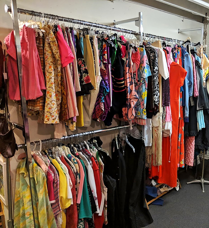 A rainbow of vintage fashion where every hanger holds a piece of history. Not just clothes&mdash;they're wearable time capsules from decades when colors weren't afraid to shout.