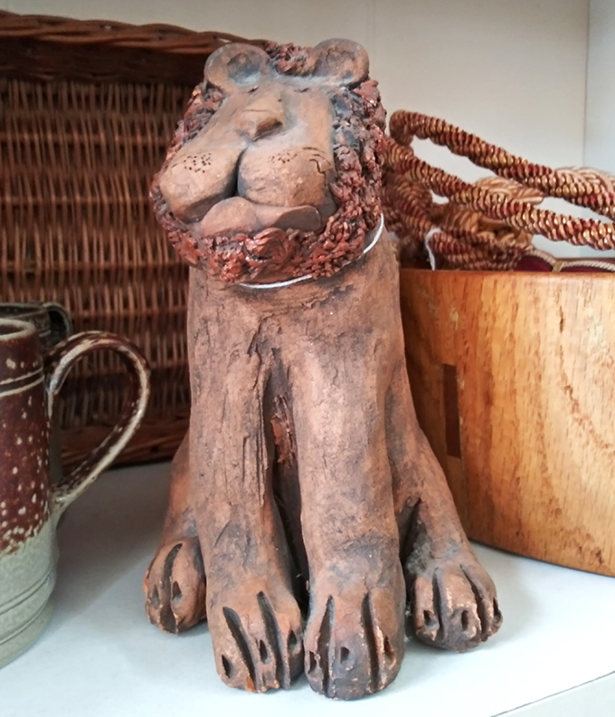 This terracotta lion isn't just decor&mdash;he's the unofficial guardian of vintage treasures, judging your purchases with his eternally amused expression.
