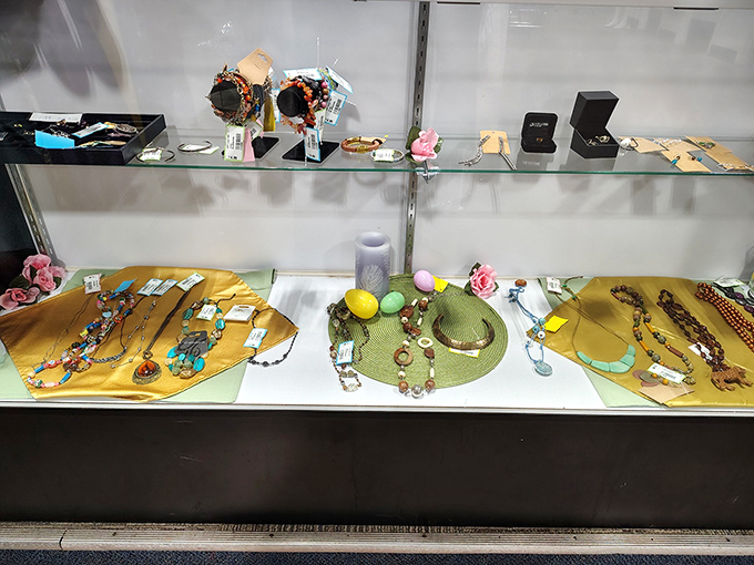 Jewelry displayed like archaeological finds from the not-so-distant past. That green hat might have attended a Derby, those necklaces possibly danced at weddings.