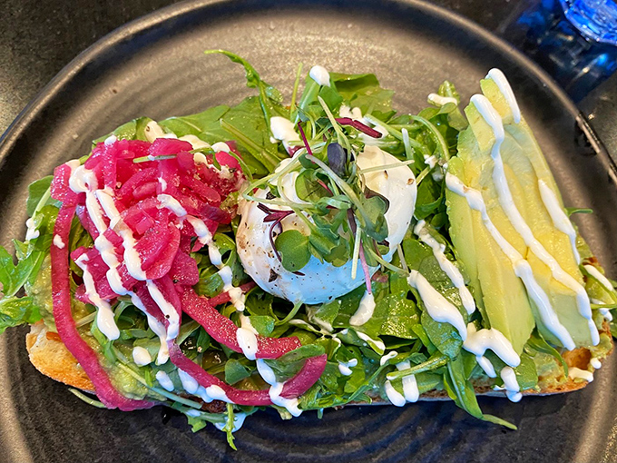 Avocado toast elevated to art form – because sometimes simple ingredients create the most extraordinary magic.