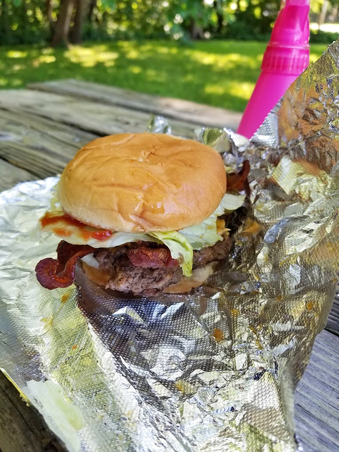 Behold the bacon cheeseburger in its natural habitat&mdash;where lettuce, tomato, and special sauce create the holy trinity of handheld happiness.