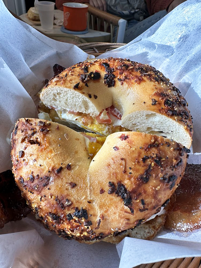 This everything bagel sandwich isn't messing around. It's the architectural achievement your morning deserves, with layers that would make Frank Lloyd Wright jealous.