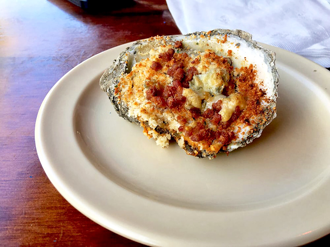 This baked oyster isn't just food&mdash;it's a tiny ocean-flavored miracle topped with buttery breadcrumbs and what appears to be bacon. Divine intervention.