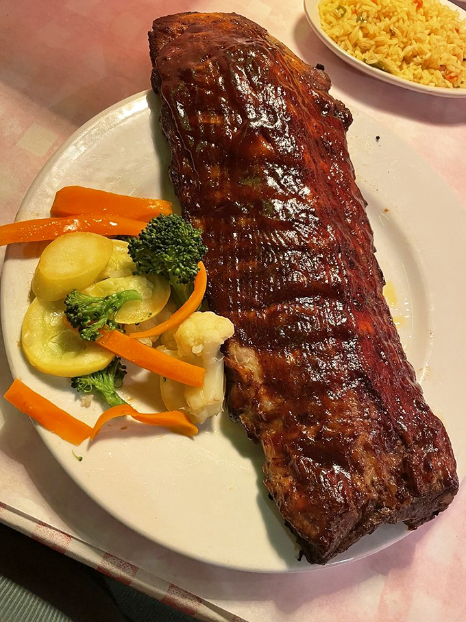 These barbecue ribs arrive glazed to perfection, proving pork can be just as magnificent.