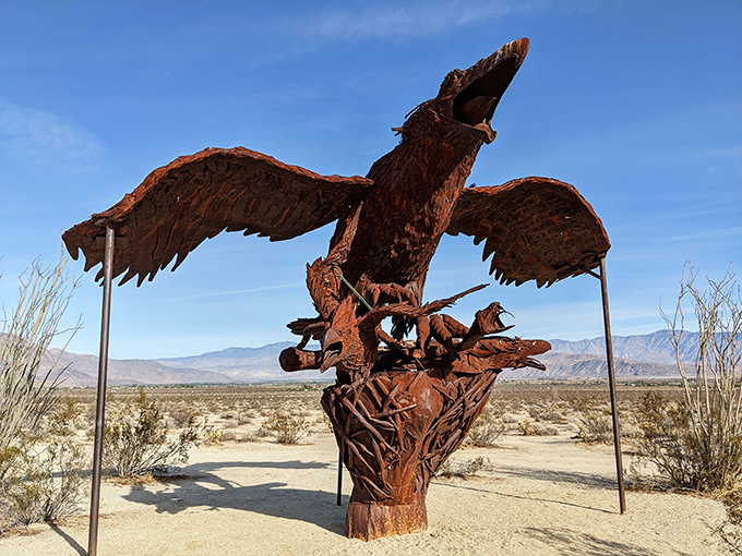 Taking flight without ever leaving the ground, this magnificent metal eagle spreads its wings above an intricate nest, defying gravity and expectations.