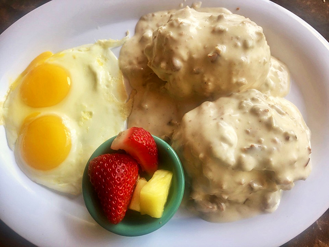 Biscuits and gravy that could make your grandmother question her own recipe, with sunny-side eggs standing by as willing accomplices.