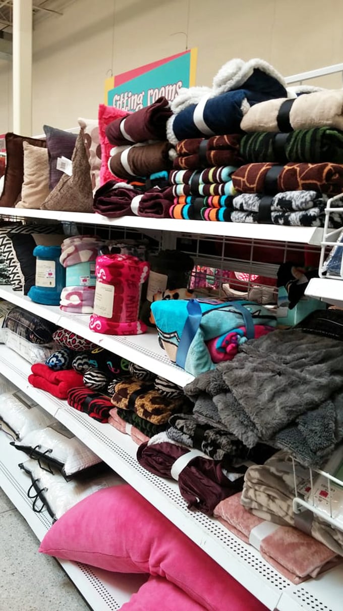 Cozy throws and plush pillows stacked with precision&mdash;because nothing says "adulting" like getting genuinely excited about affordable home textiles.