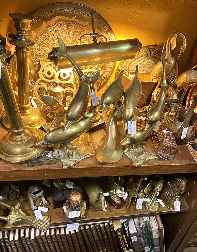 The brass menagerie gleams under display lights, with that owl looking wise enough to have witnessed the entire 20th century unfold.