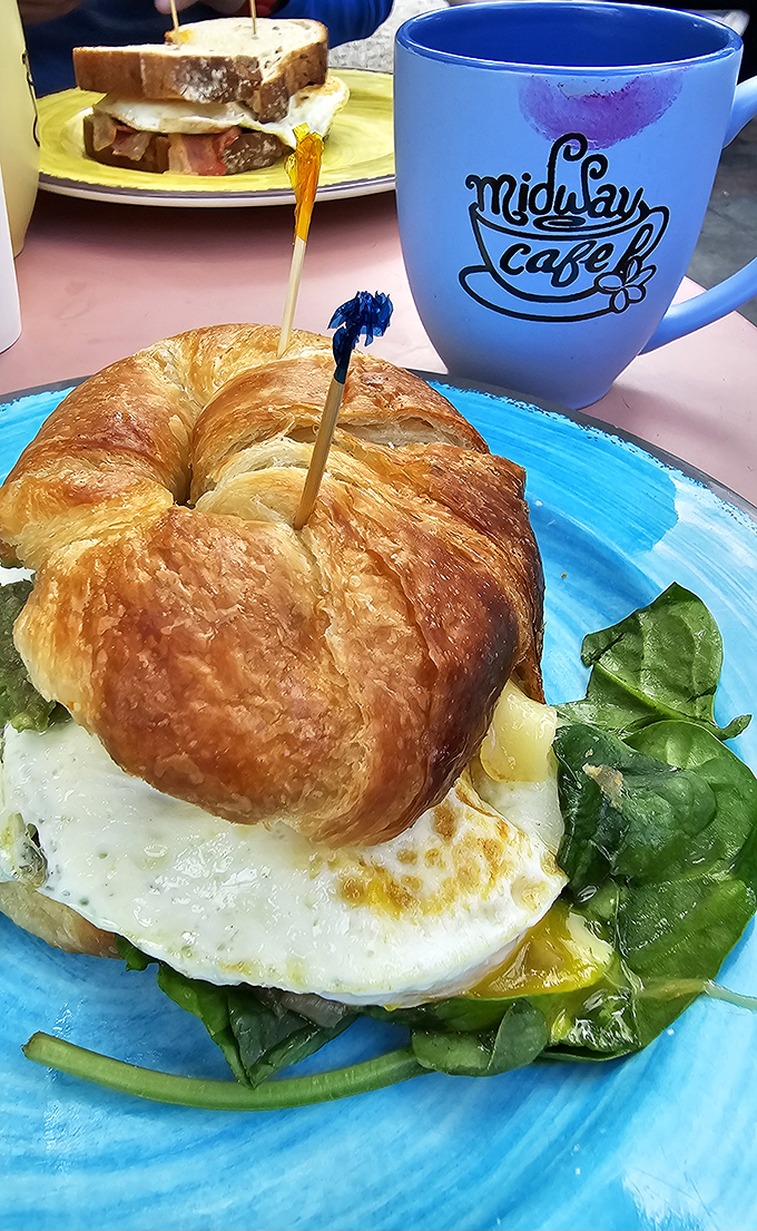The perfect breakfast sandwich doesn't exi&mdash; Oh wait, here it is! Golden croissant, perfectly cooked egg, and that signature blue mug standing guard.