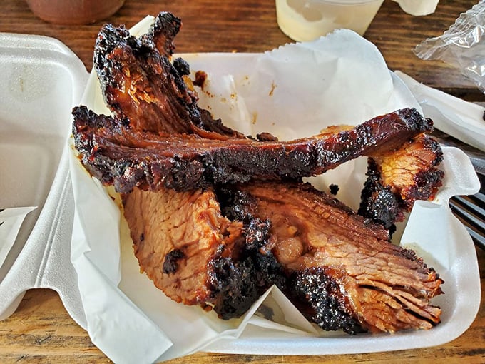 Brisket with a smoke ring so perfect it could be framed in a museum dedicated to the art of patience and fire management.