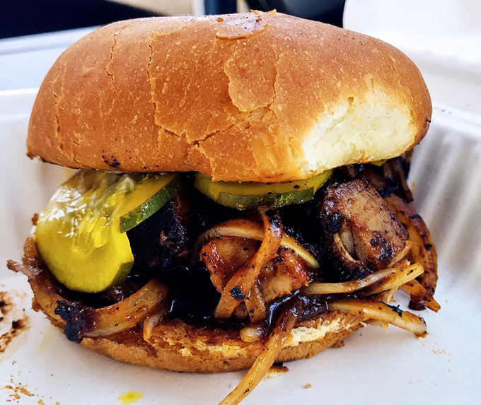 Not all heroes wear capes; some come on toasted buns with caramelized onions and house pickles that transform lunch into an event.