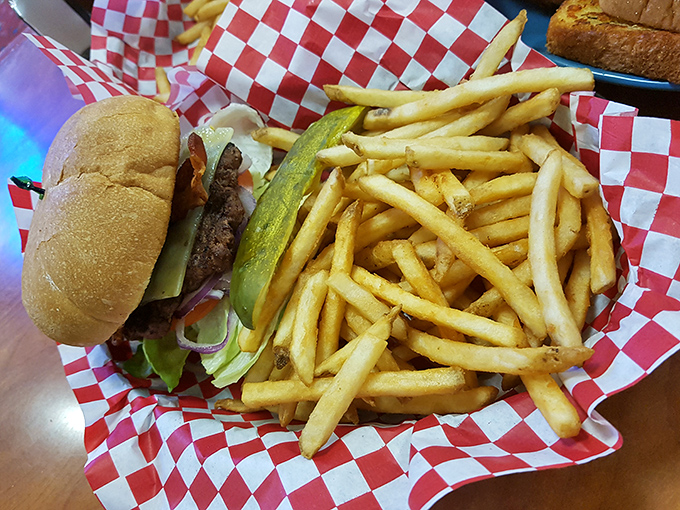 The burger basket arrives like a Norman Rockwell painting you can eat, with fries so golden they deserve their own retirement account.
