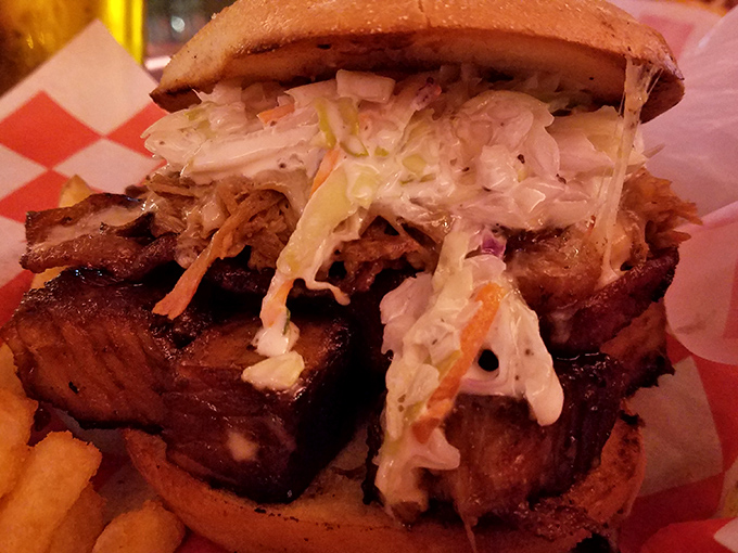 This burnt ends sandwich isn't just a meal, it's an architectural marvel of smoke-kissed meat and tangy slaw that requires both hands and zero shame.