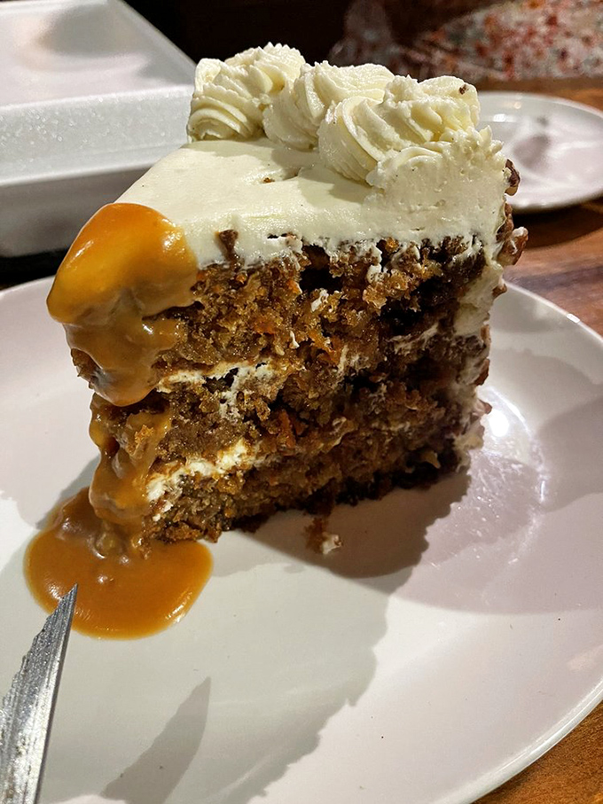Behold the legendary carrot cake in all its glory&mdash;layers of spiced perfection drizzled with caramel that would make even the Easter Bunny abandon his diet.