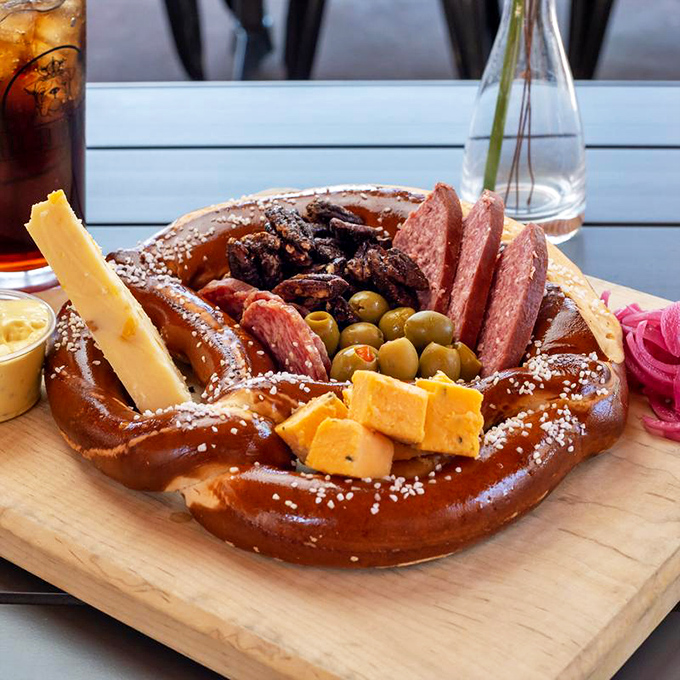 The Giant Soft Pretzel isn't just a starter&mdash;it's an edible amphitheater hosting a delicious ensemble of meats, cheeses, and olives. Sharing optional but not recommended.