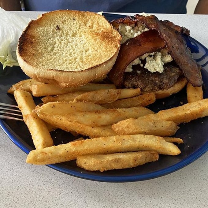 When seafood isn't calling your name, this burger answers with bacon, cheese, and a toasted bun that means serious business.