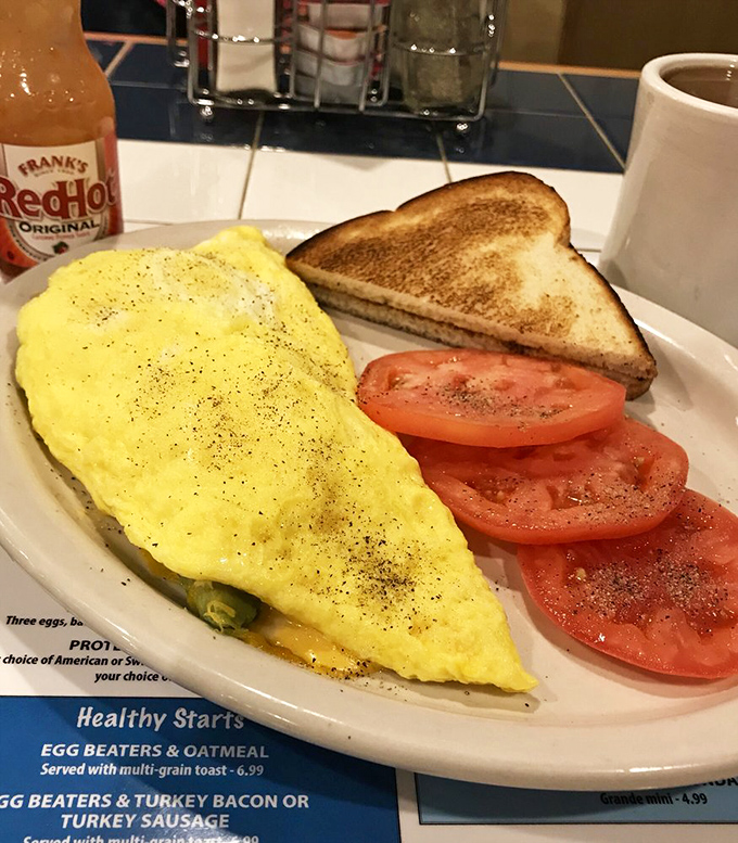This omelet doesn't just contain cheese&mdash;it celebrates it, with fresh tomatoes providing that perfect acidic counterpoint to morning richness.