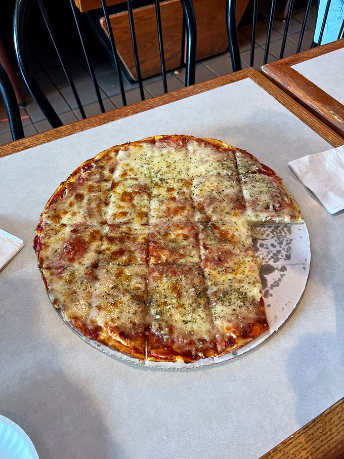 Pizza perfection in its simplest form. That cheese pull would make any food photographer weep with joy&mdash;and any hungry patron reach for a slice.