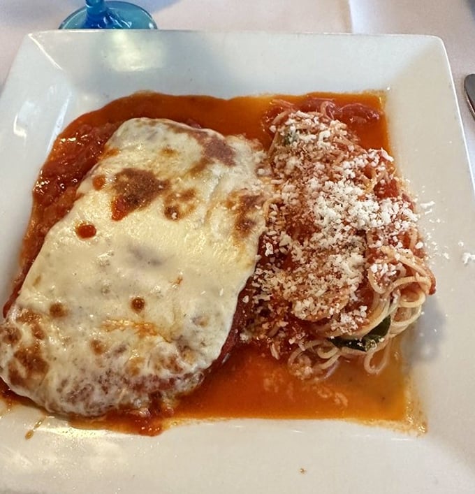 This isn't just chicken parmigiana; it's a golden-crusted love letter to Italian-American comfort food at its finest.