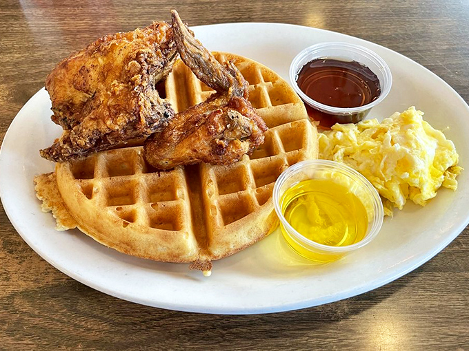 The chicken and waffle holy trinity: crispy bird, fluffy waffle, maple syrup. A breakfast-lunch hybrid that makes you question why we ever separated them.