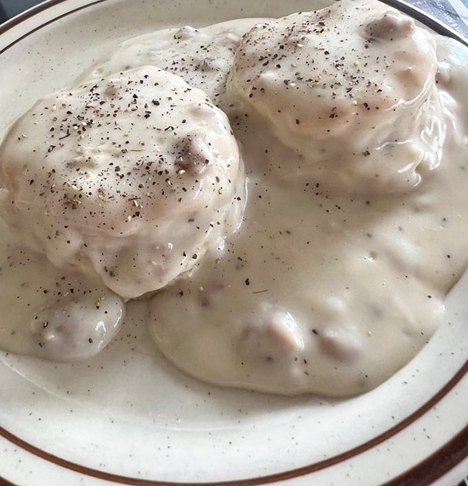 Chicken croquettes smothered in creamy gravy—the kind of dish that makes you want to hug whoever invented it. Comfort food engineering at its finest.