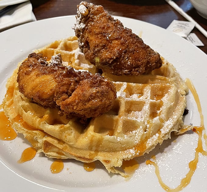 When chicken meets waffle, magic happens - crispy perfection nestled atop fluffy squares of pure breakfast joy.