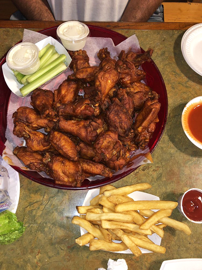 These wings aren't just food; they're a religious experience with crispy skin, tender meat, and enough sauce to warrant extra napkins.