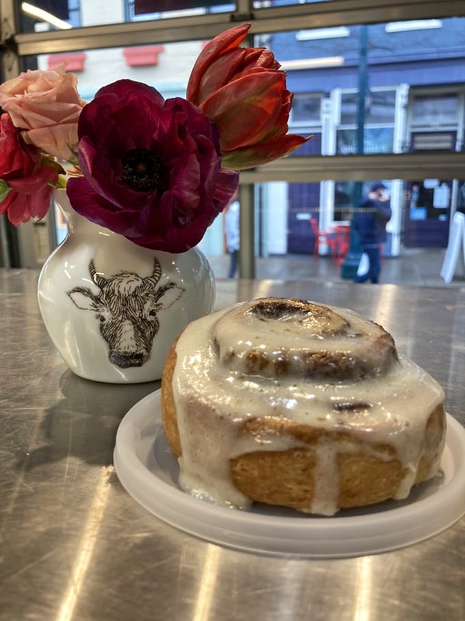 The holy grail of cinnamon rolls, positioned next to fresh flowers. Some might call this still life; I call it breakfast perfection.
