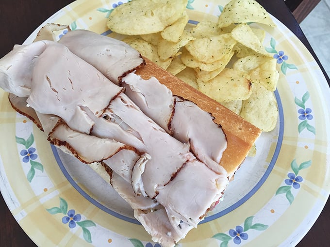 The turkey sandwich that launched a thousand road trips. Thick-cut, perfectly moist turkey that makes the supermarket deli counter hang its head in shame.