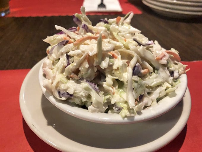 This isn't just coleslaw; it's the cool, creamy counterpoint to Pittsburgh's hot sandwiches. A perfect balance of crunch and tang in every forkful.