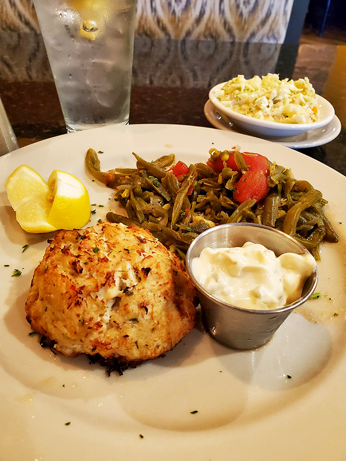 When a crab cake arrives with green beans this vibrant, you know someone in the kitchen actually cares about vegetables too.